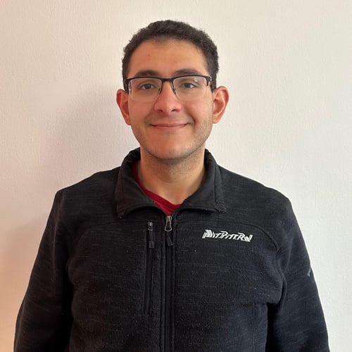 Parallel Trajectories: Behind the Scenes of the Indy Autonomous Challenge